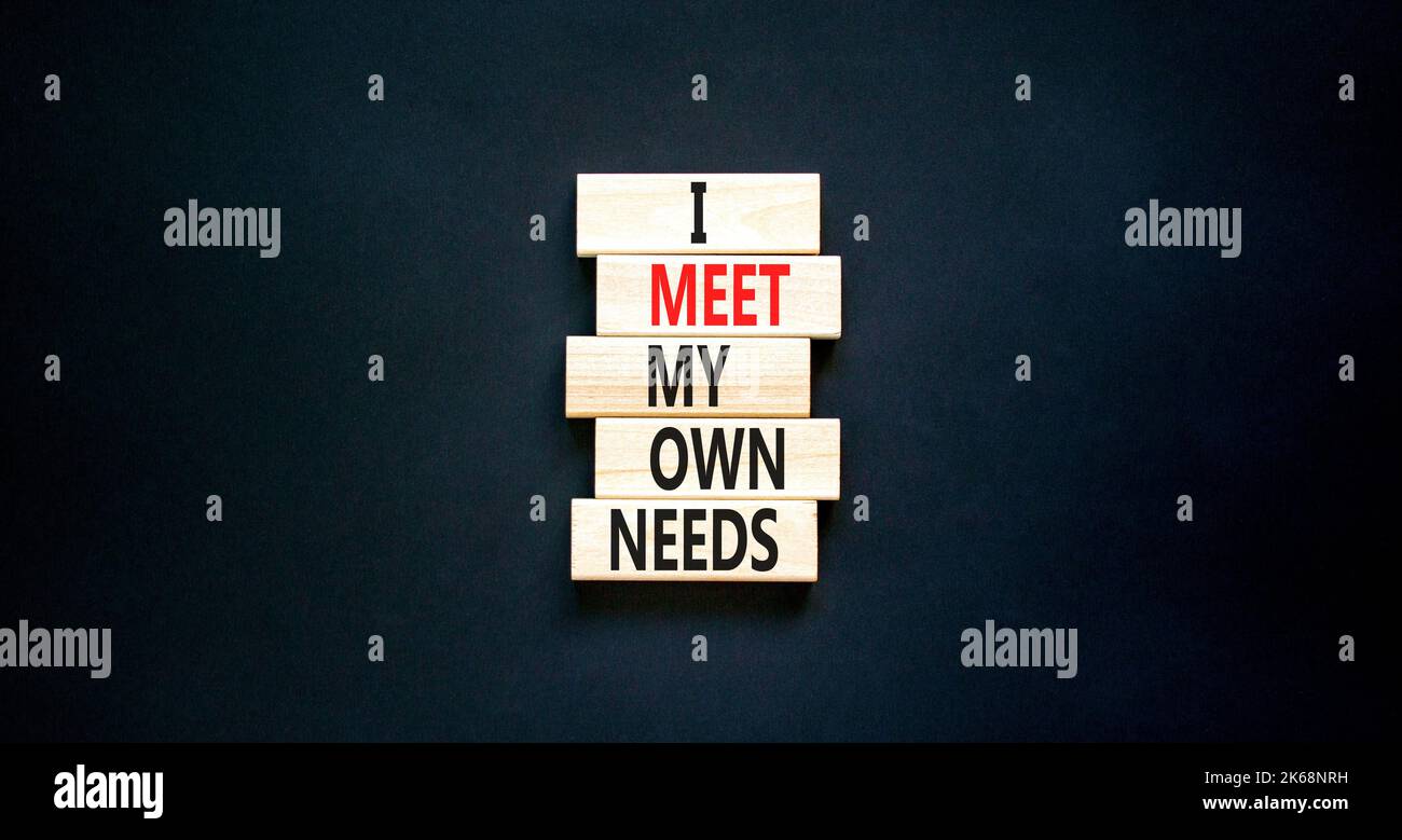 I meet my own needs symbol. Concept words I meet my own needs on wooden blocks. Beautiful black ...