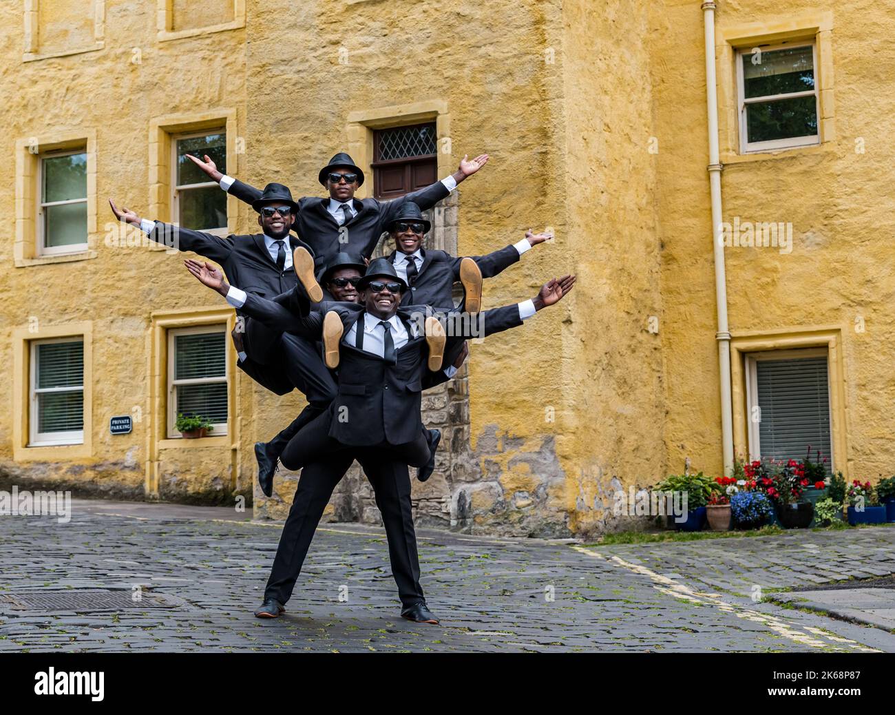 Black Blues Brothers acrobatic group perform in Dean Village creating a ...