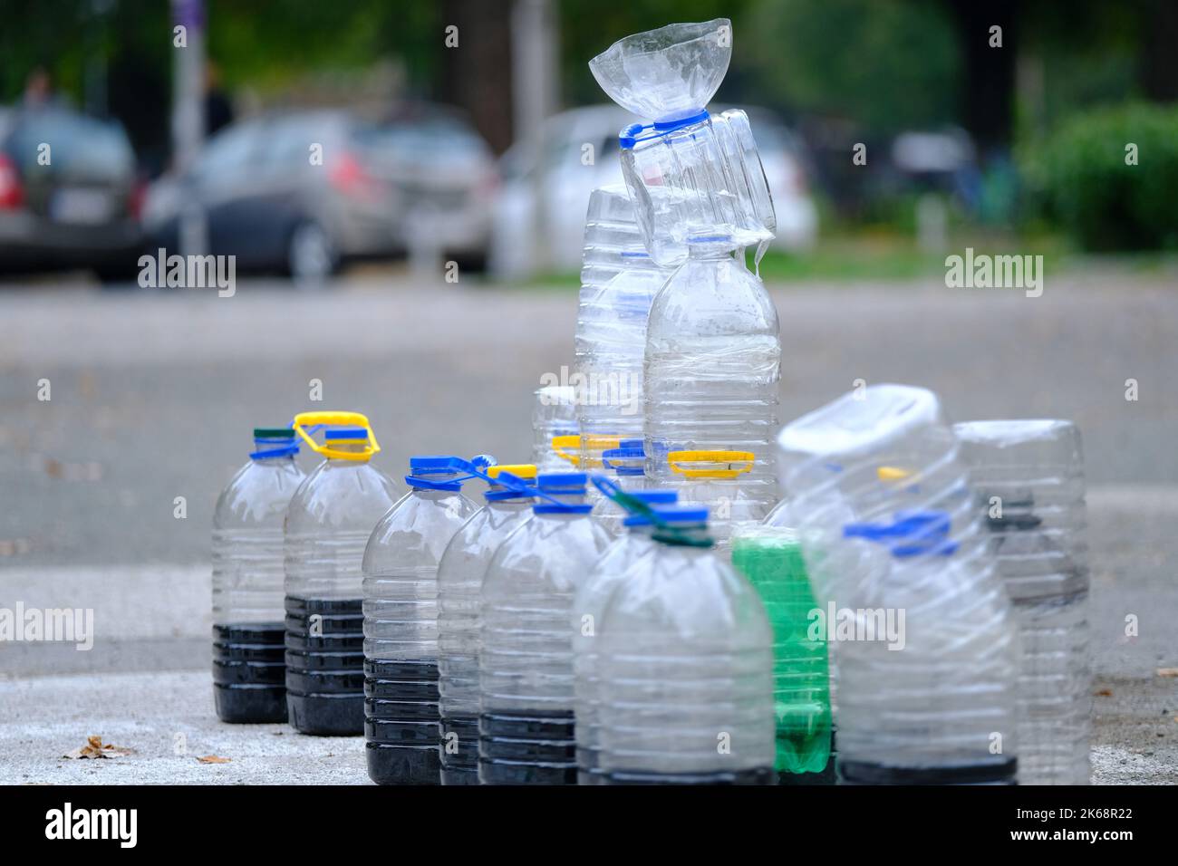 Big chess board of chalk with chess pieces made of plastic bottles seen ...