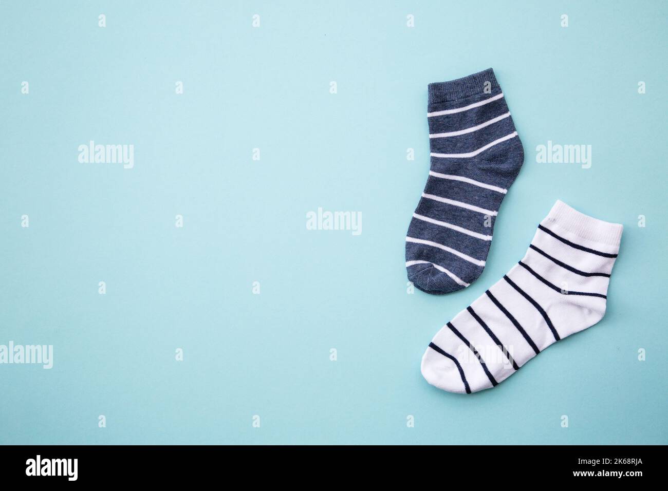 Odd socks day concept. Mismatch socks at color background. Top view ...