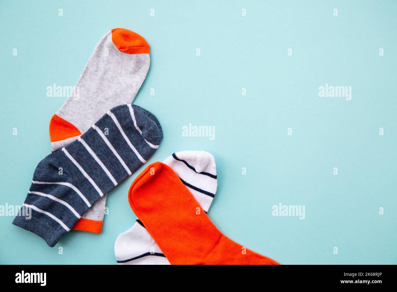 Odd socks day concept. Mismatch socks at color background. Top view ...