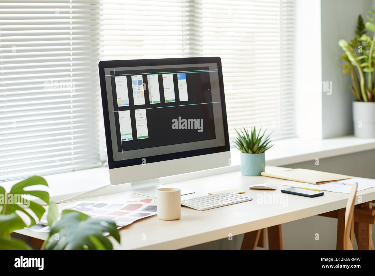 Minimal background image of computer with mobile app designs on screen ...