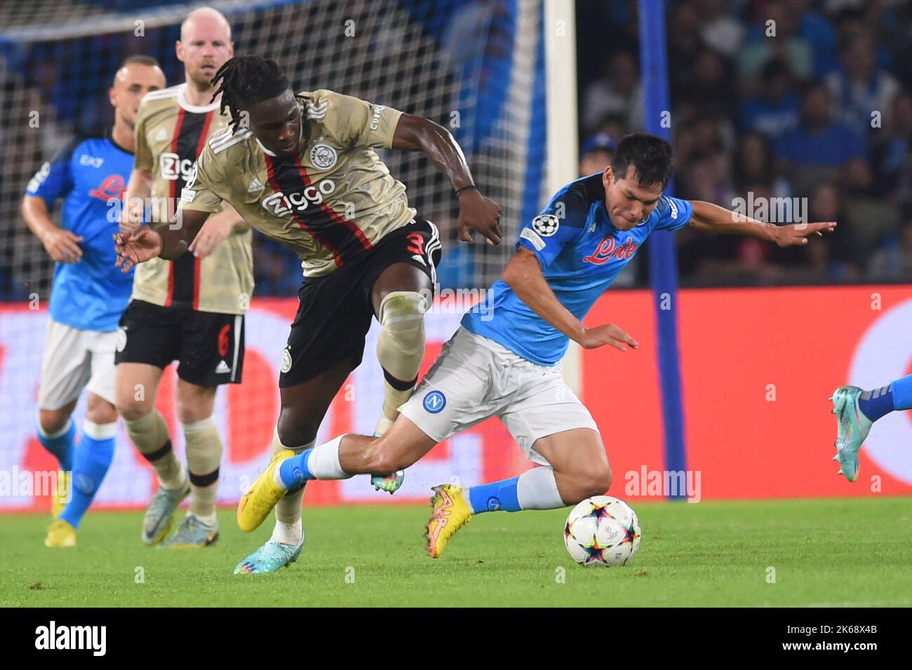 Hirving Lozano of SSC Napoli and Perr Schuurs competes for the ball ...