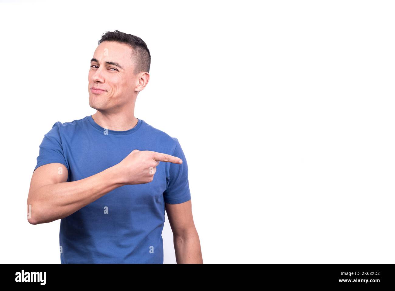 Expressive man pointing to the side with the finger Stock Photo - Alamy