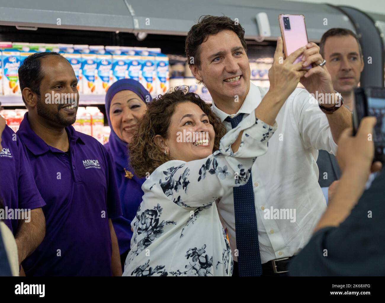 Prime Minister Justin Trudeau poses for photos with patrons and staff ...
