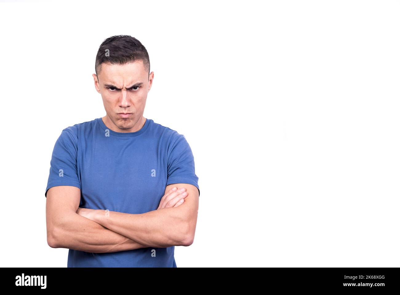 Man with his arms crossed in anger Stock Photo - Alamy