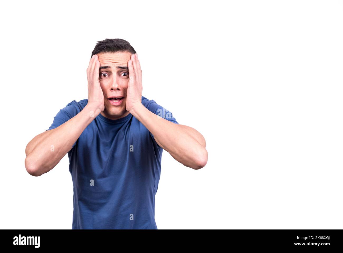 Man with hands on the face and expression of panic Stock Photo - Alamy