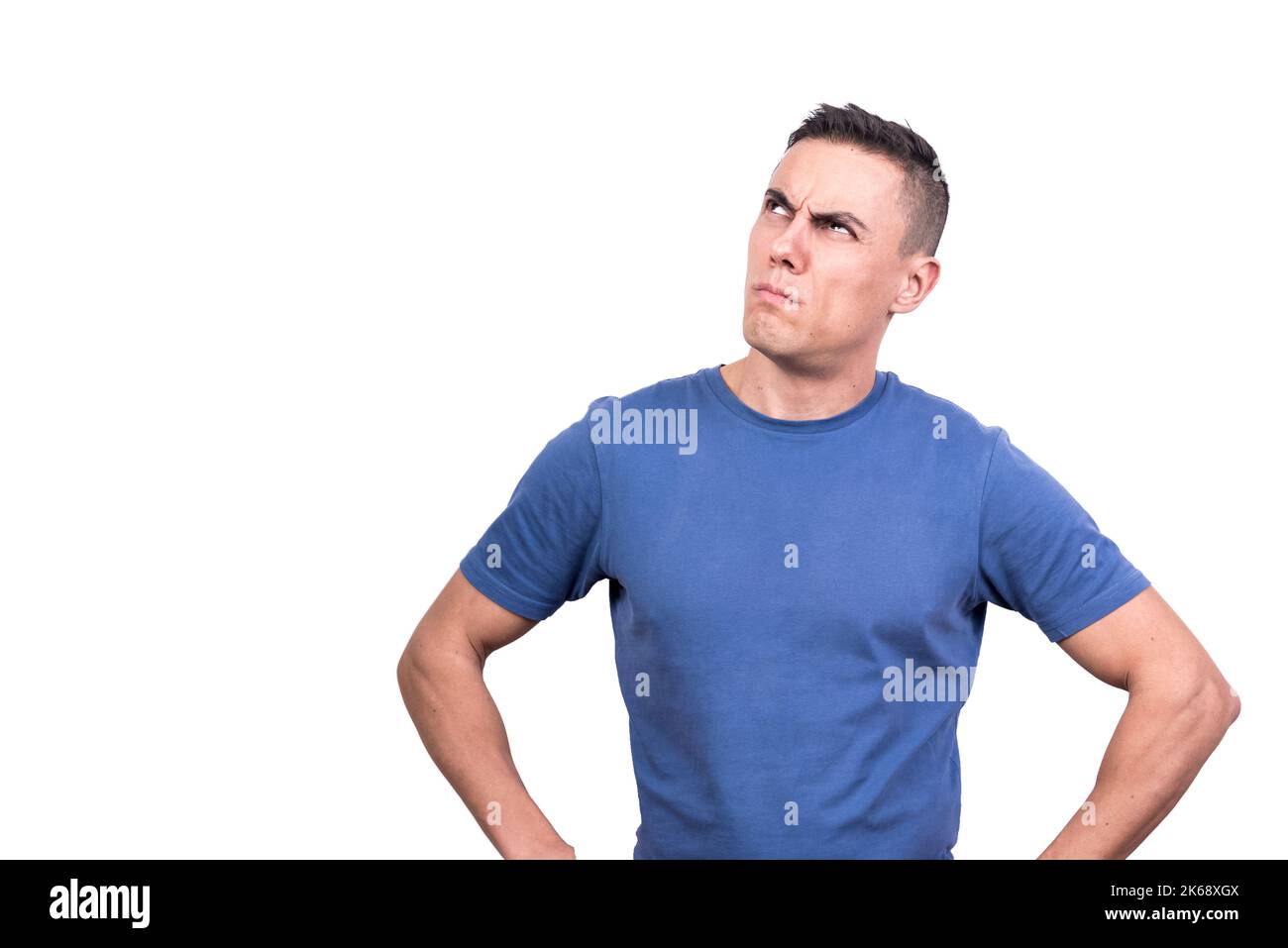 Man looking up with expression of doubt while thinking Stock Photo - Alamy