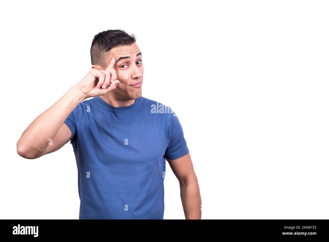 Man with his finger on his forehead gesturing he's thinking Stock Photo ...