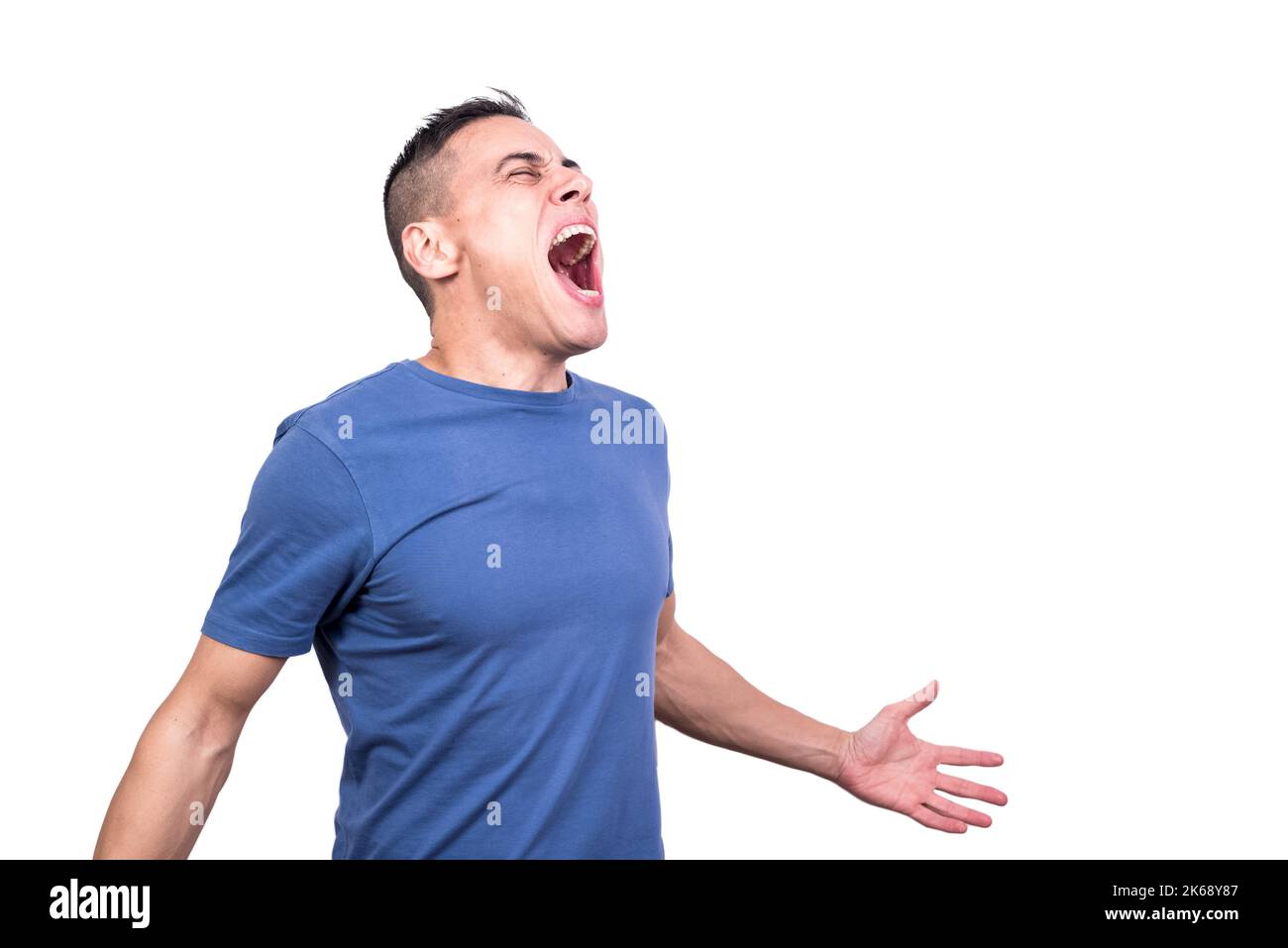 Portrait of a man screaming with open arms Stock Photo - Alamy