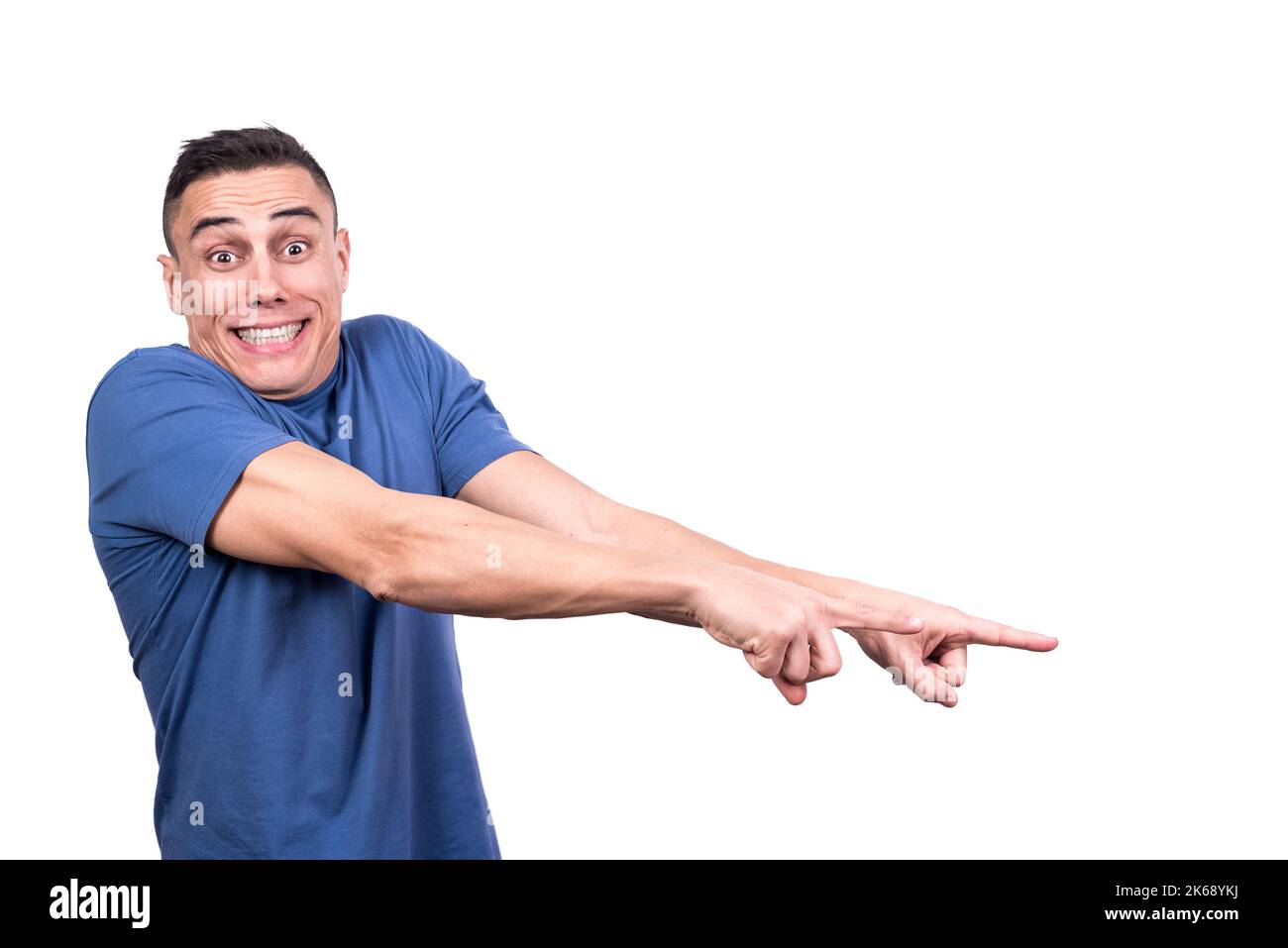 Man smiling while pointing to the side Stock Photo - Alamy