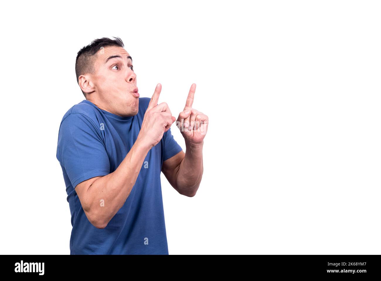 Profile of a surprised man pointing up with his fingers Stock Photo - Alamy
