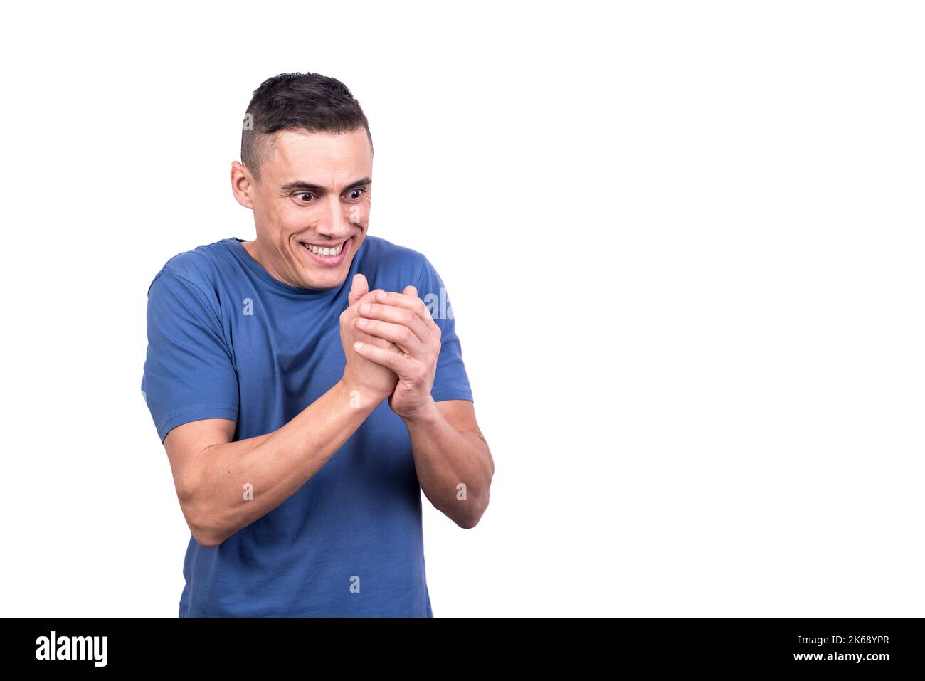 Man scrubbing his hands with a greedy expression Stock Photo - Alamy