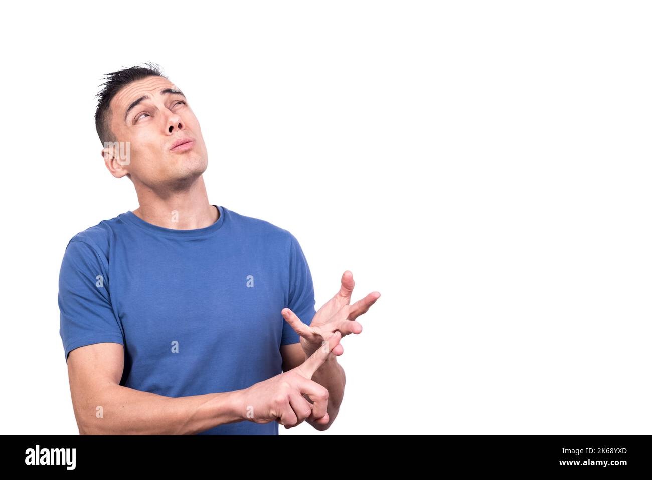 Man with expression of concentration while counting with his fingers ...