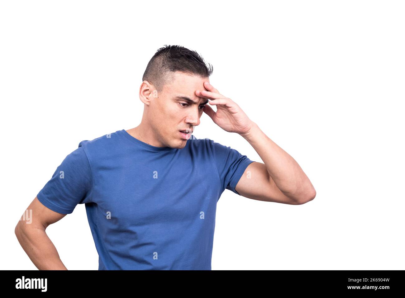 Man with one hand on his forehead thinking worried Stock Photo - Alamy