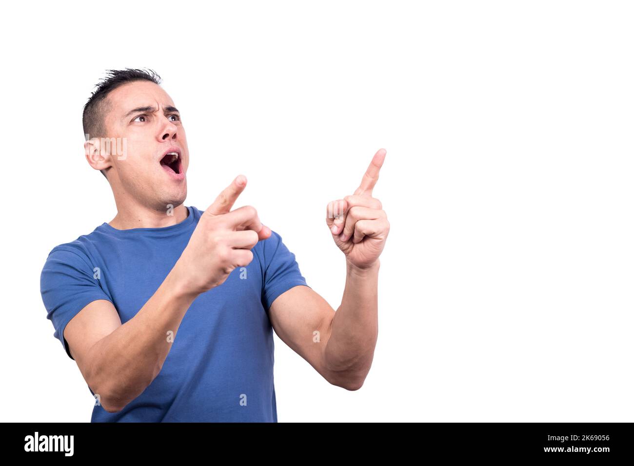 Excited man pointing upwards with his fingers Stock Photo - Alamy