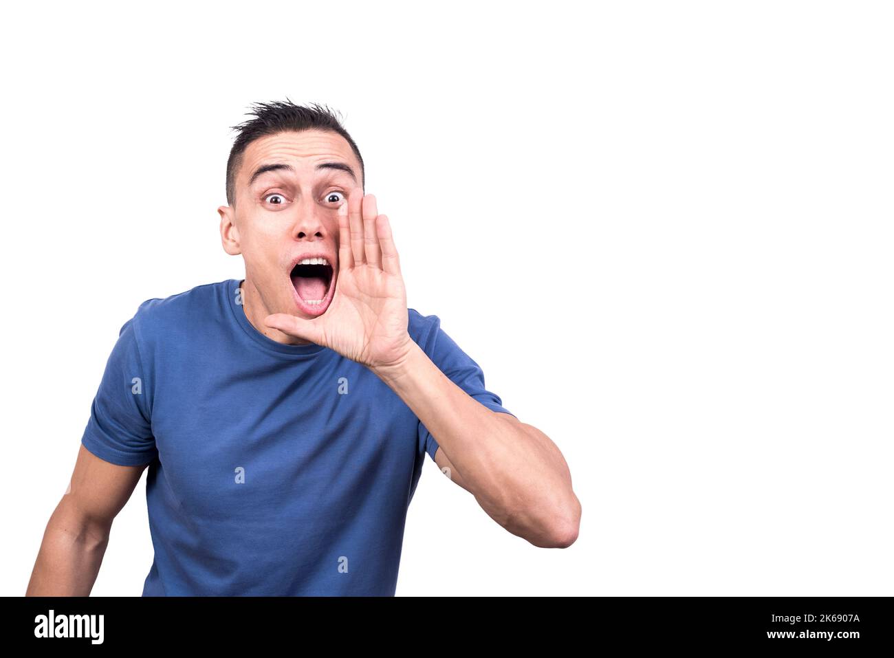 Man with hand next to mouth screaming Stock Photo - Alamy