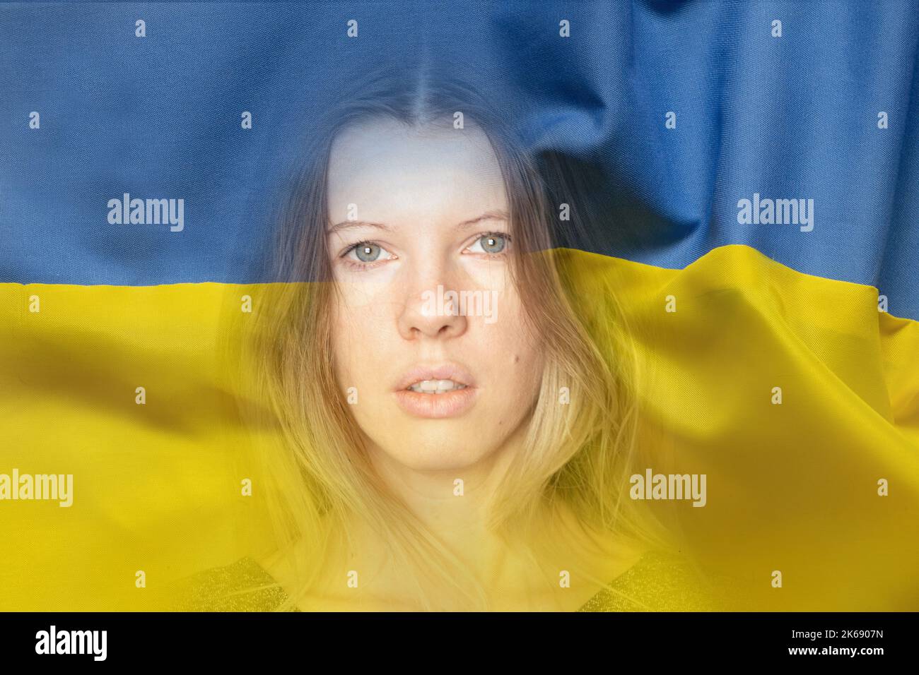 Yellow-blue national flag of Ukraine and the face of a girl, stop the ...