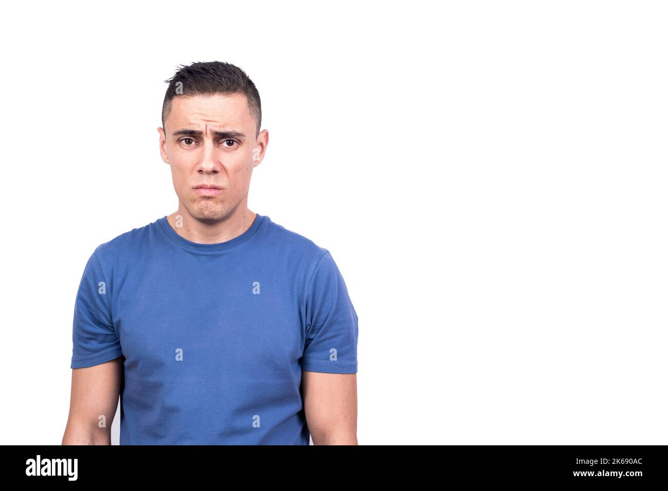 Sad man standing while facing the camera Stock Photo - Alamy