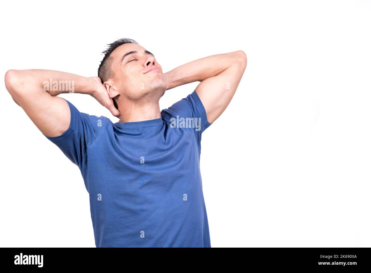 Man with his hands on the back of neck relaxing Stock Photo - Alamy