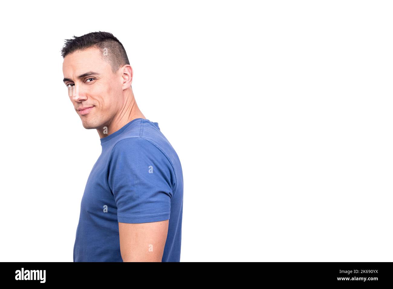 Man turning to the camera with cocky expression Stock Photo - Alamy