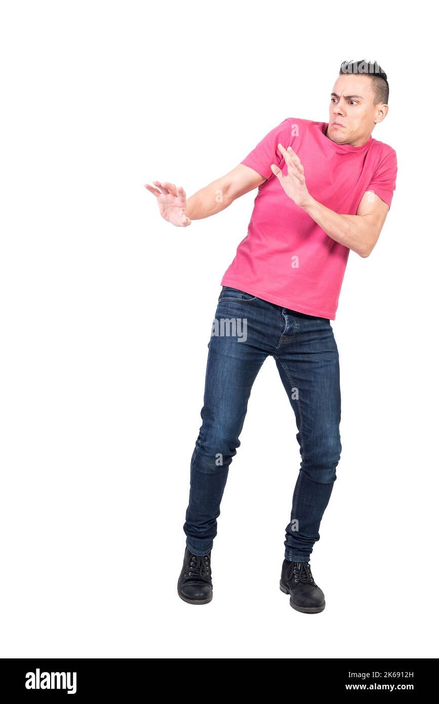 Alerted male making protective gesture. White background Stock Photo ...