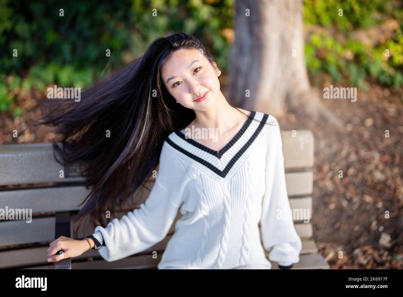 Sequence Young Woman Flipping Long Black Hair Stock Photo - Alamy