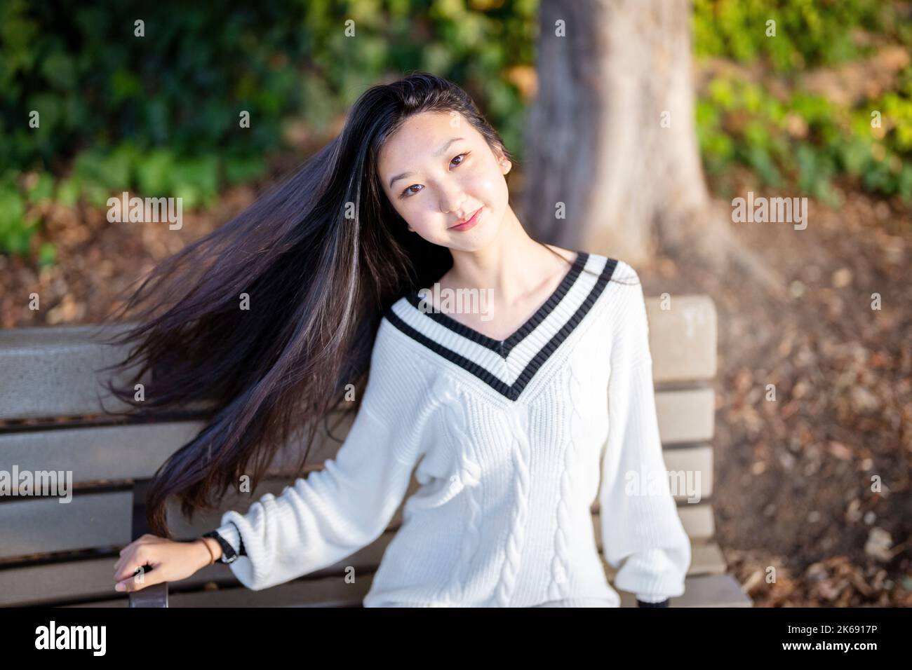 Sequence Young Woman Flipping Long Black Hair Stock Photo - Alamy