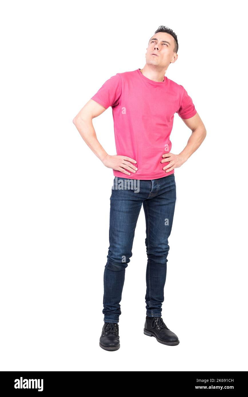Skeptic man looking up and thinking. White background Stock Photo - Alamy