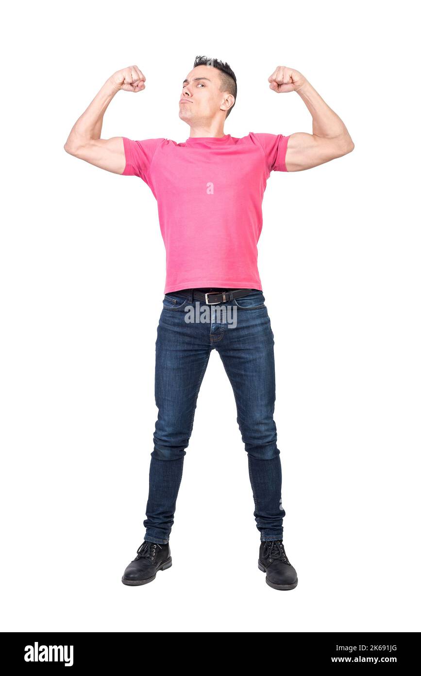 Confident muscular guy showing biceps in white studio Stock Photo - Alamy