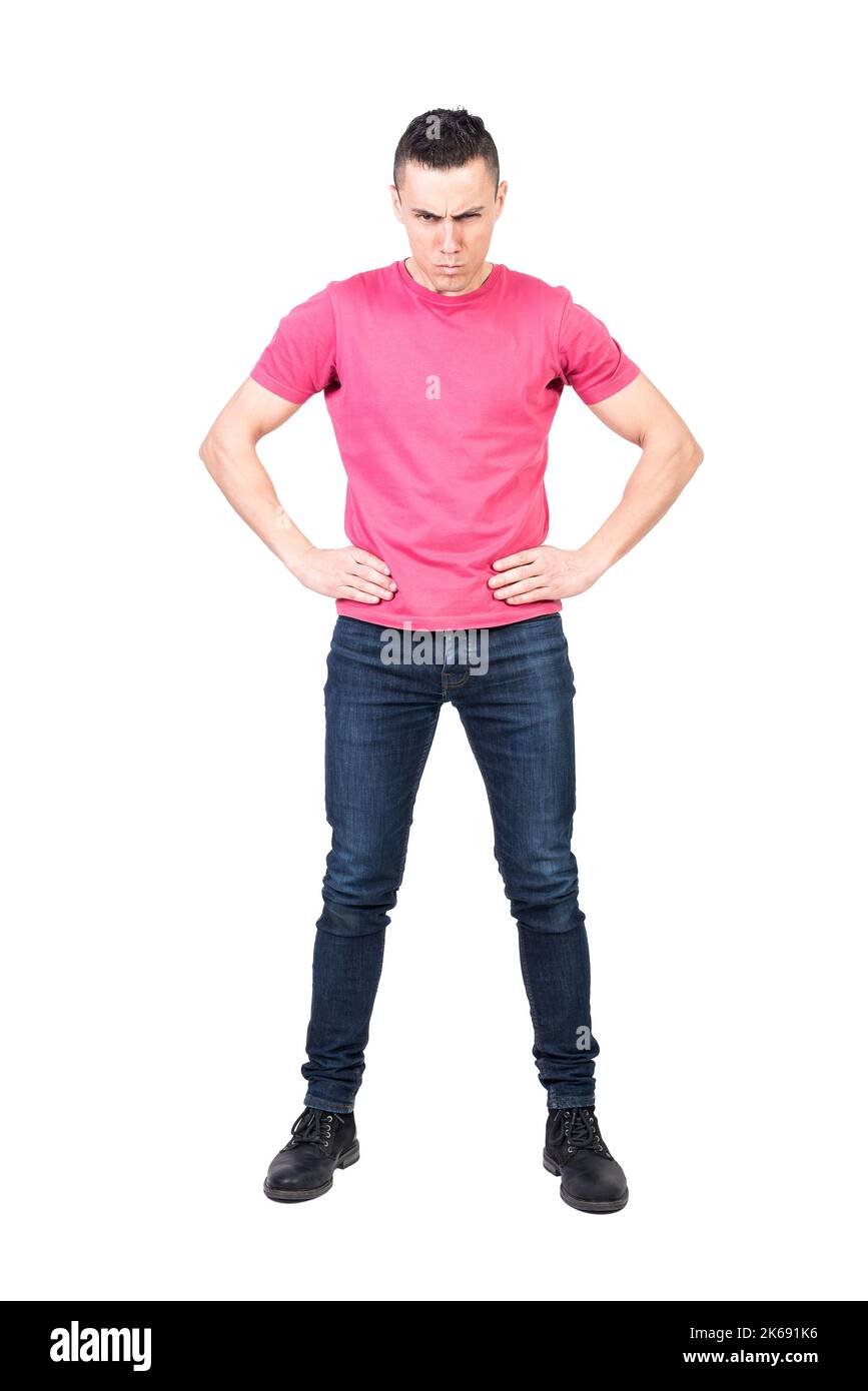 Grumpy man with hands on waist looking at camera Stock Photo - Alamy