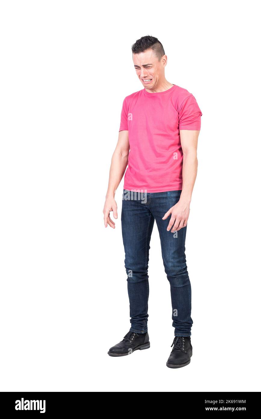 Melancholic young guy crying against white background Stock Photo - Alamy