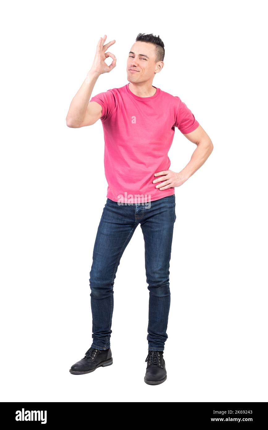 Self assured young guy showing OK gesture in white studio Stock Photo ...