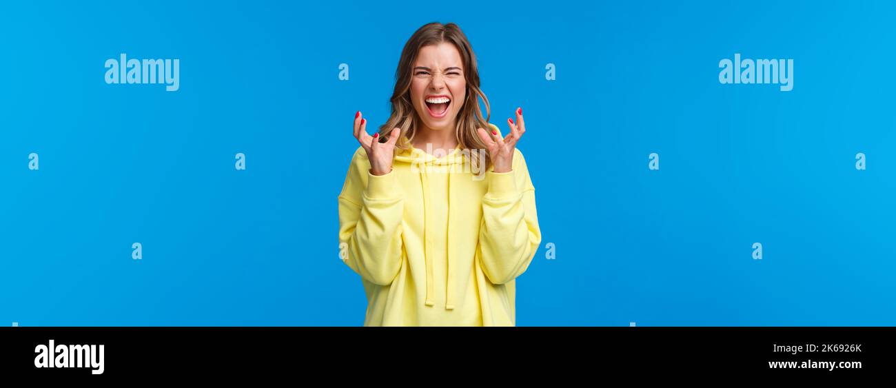 Happy young blonde woman squeeze hi-res stock photography and images ...