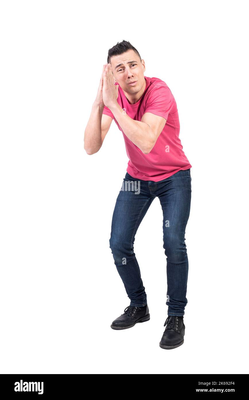 Upset man praying for forgiveness in studio Stock Photo - Alamy