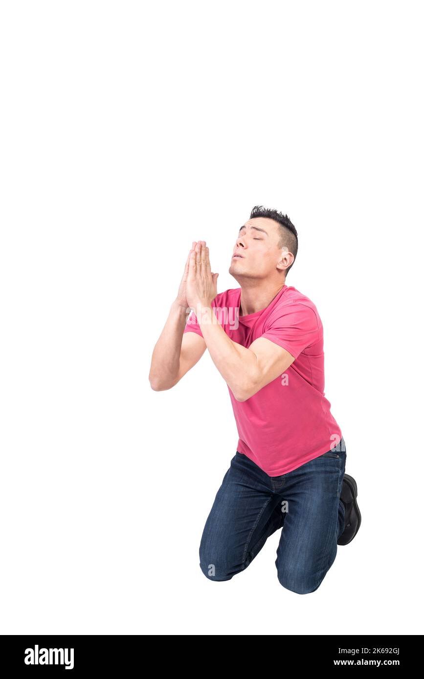 Hopeless man kneeling and praying with hands together Stock Photo - Alamy