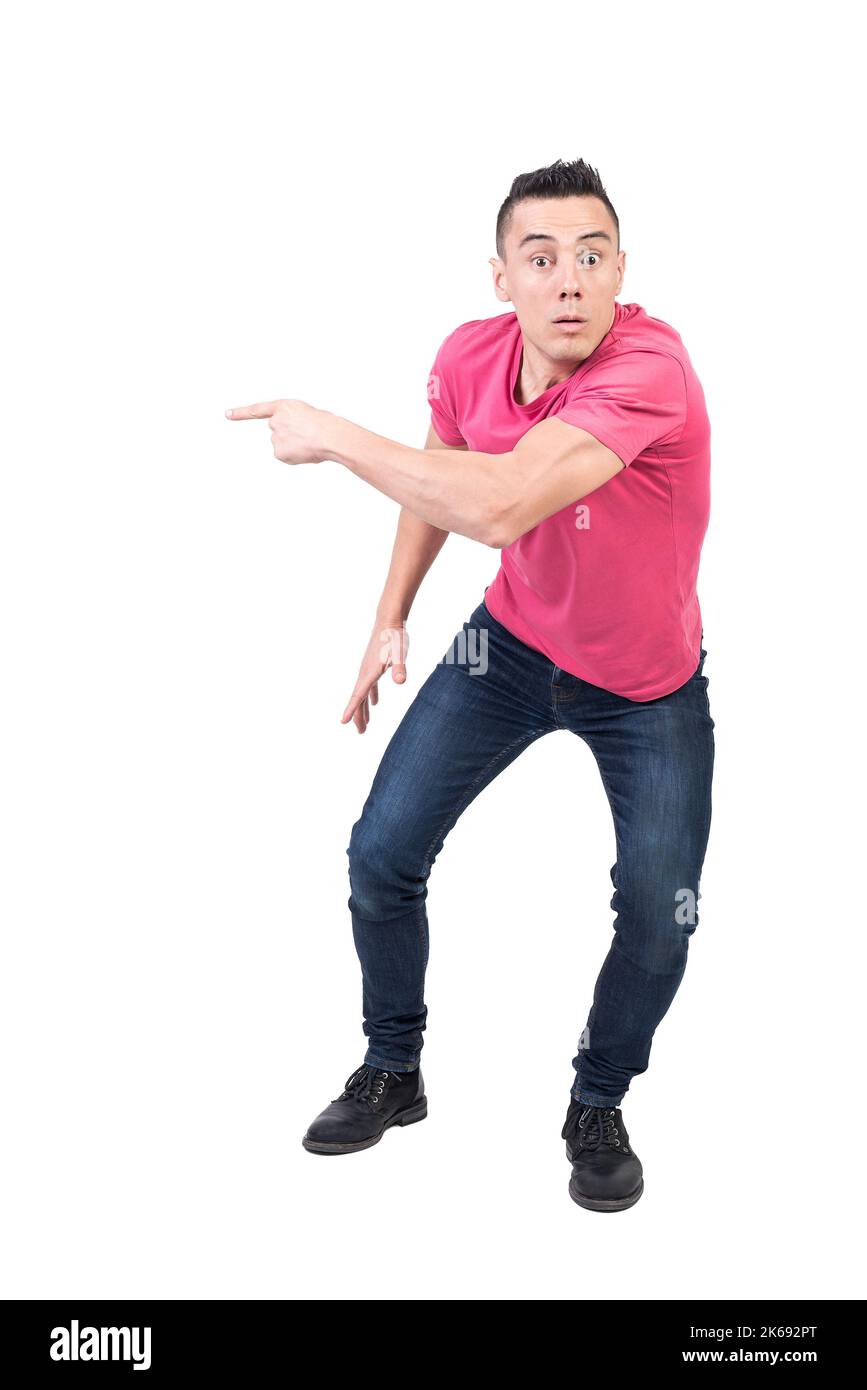 Shocked man pointing aside in studio. White background Stock Photo - Alamy