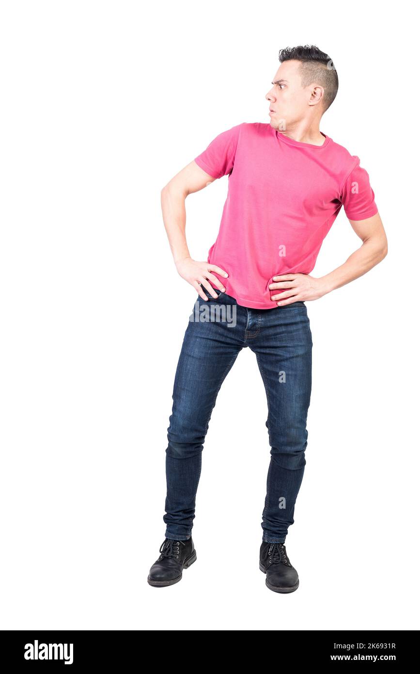 Confused man standing in studio. White background Stock Photo - Alamy