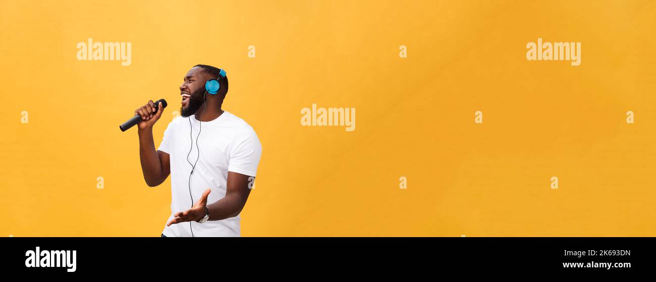 Portrait of cheerful positive chic handsome african man holding ...