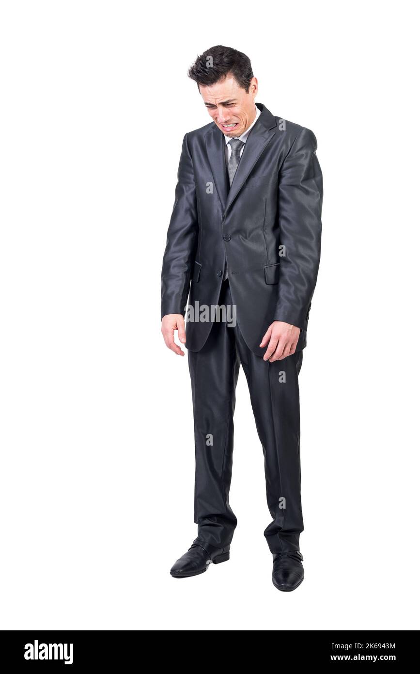 Comic businessman in suit crying in studio Stock Photo - Alamy