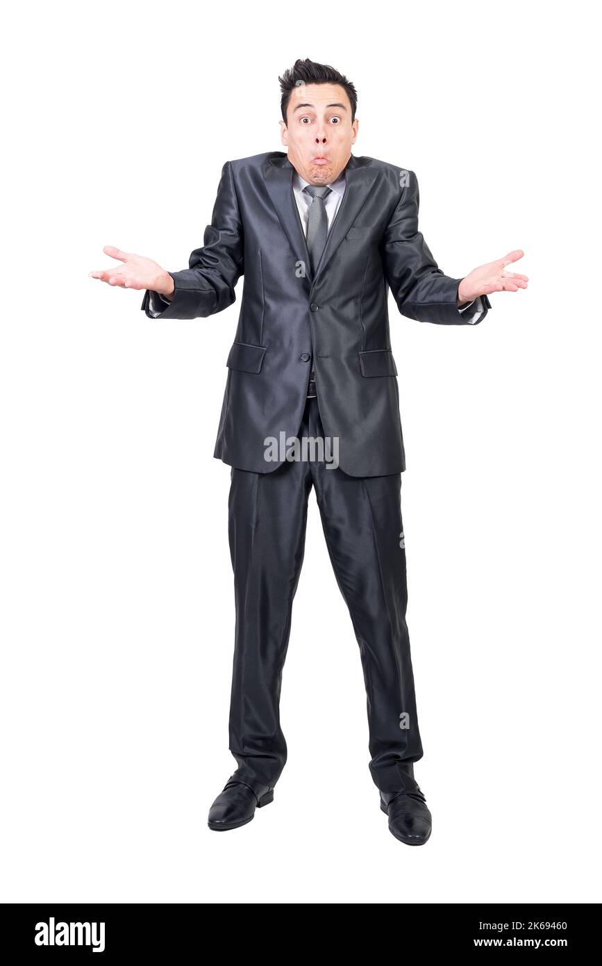 Clueless businessman shrugging shoulders against white background Stock ...
