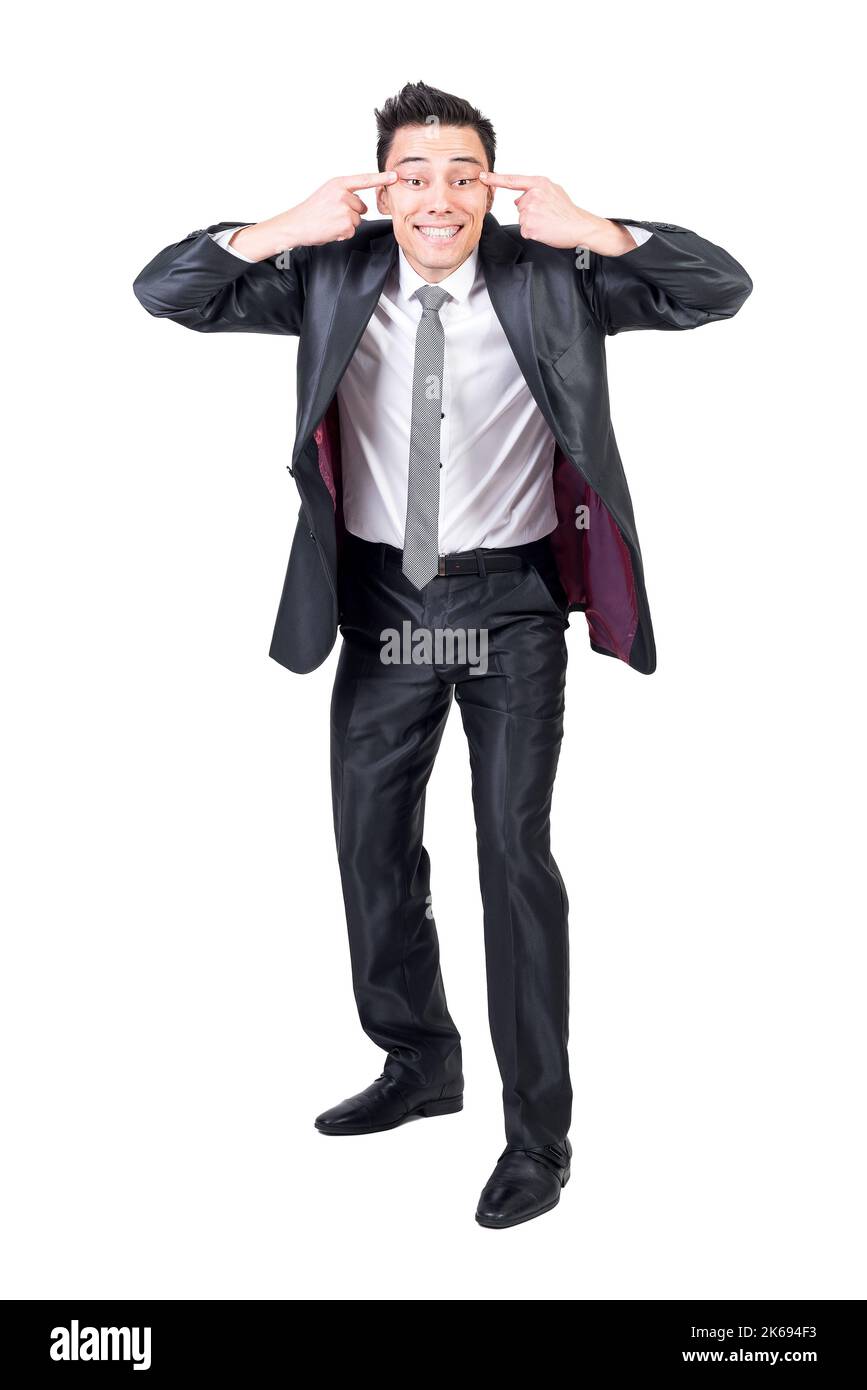 Funny businessman showing narrow eyes gesture. White background Stock ...
