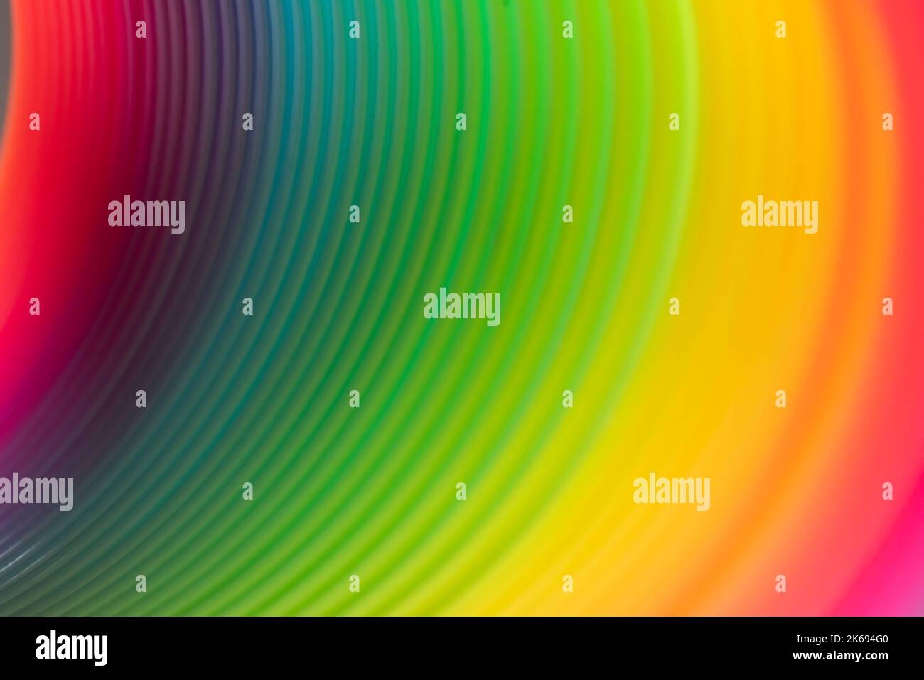Details of a rainbow coloured plastic toy Stock Photo - Alamy