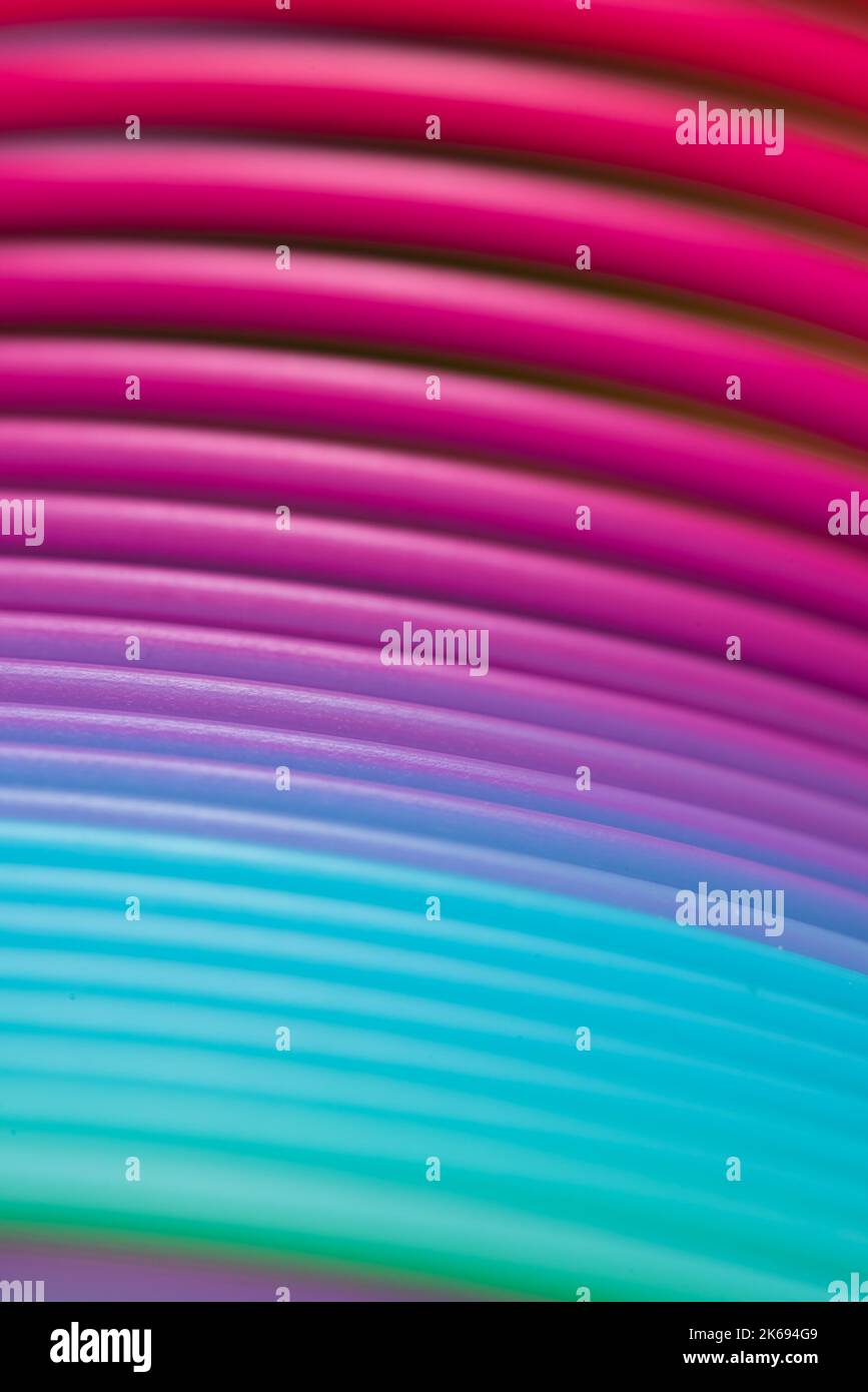 Details of a rainbow coloured plastic toy Stock Photo - Alamy