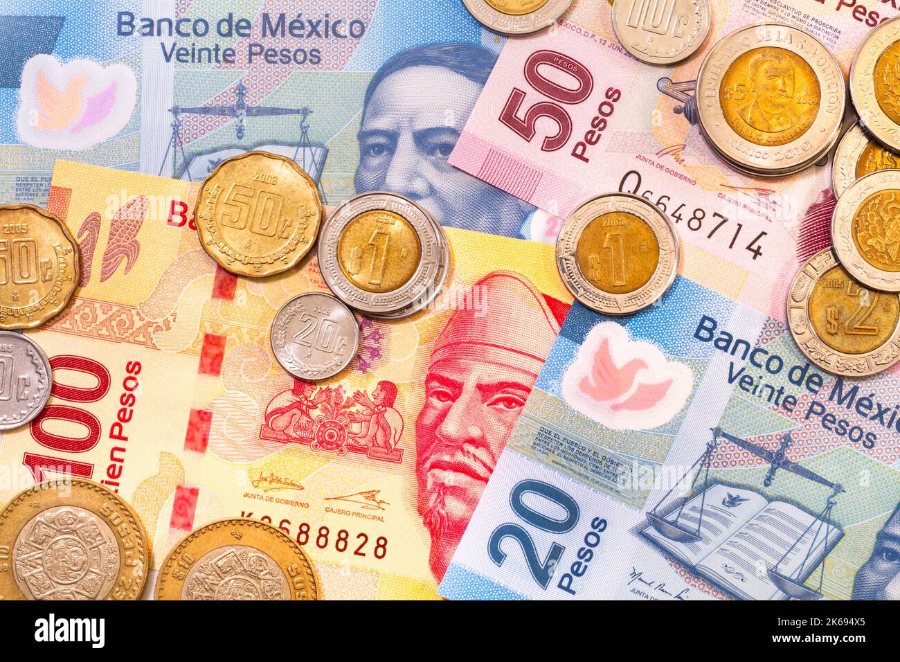 A studio shot collage arrangement of paper currency banknotes and coins ...