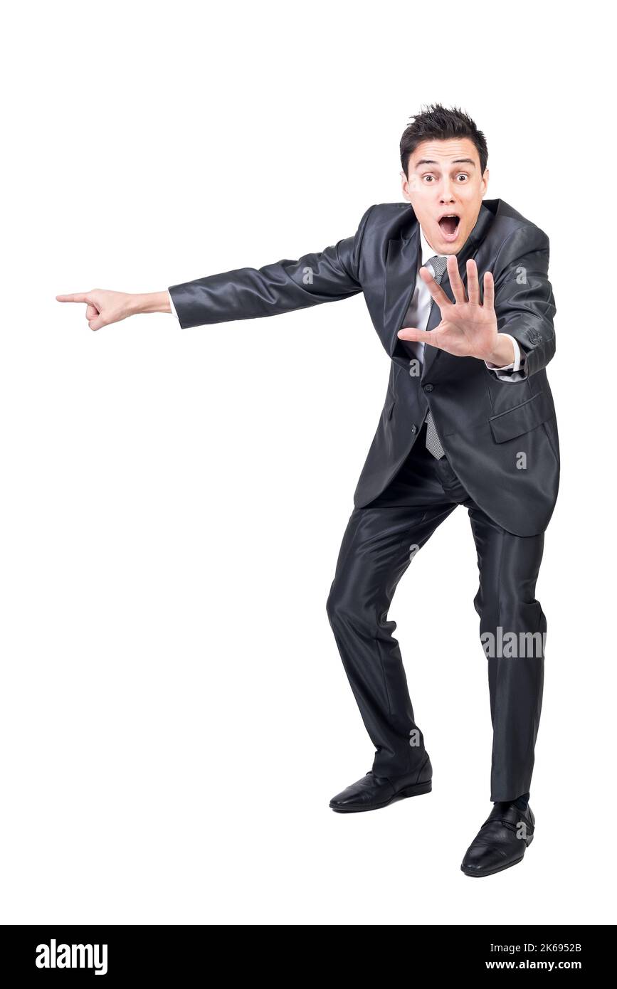 Shocked man in suit pointing aside. White background Stock Photo - Alamy