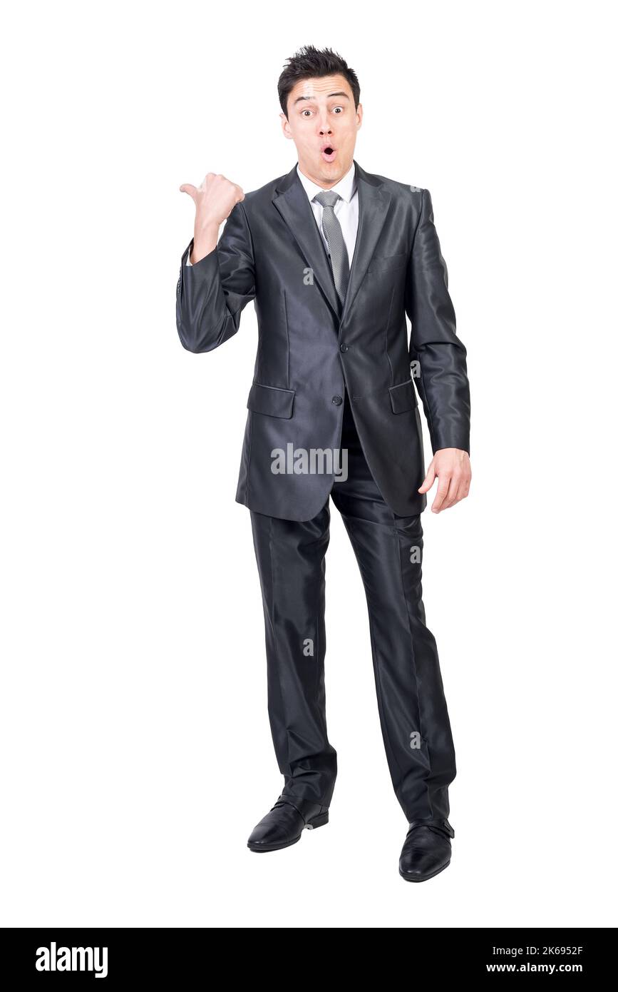 Surprised man pointing aside in studio. White background Stock Photo ...