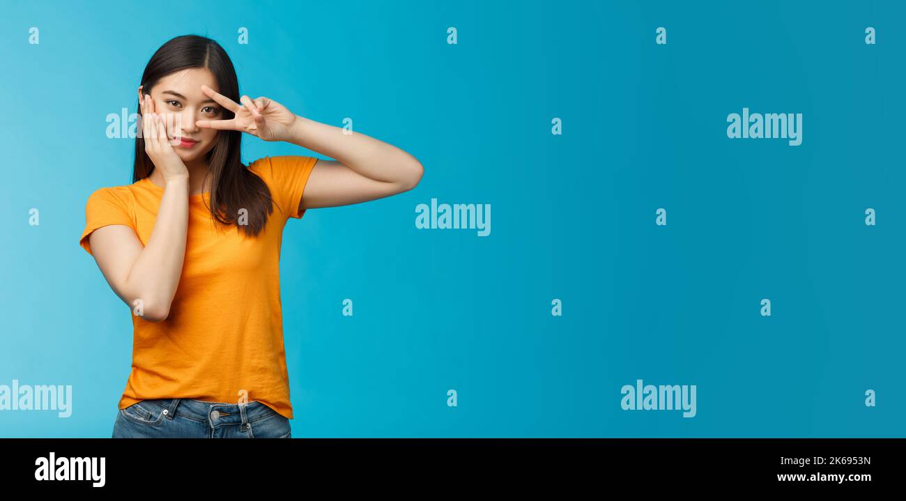 Sassy stylish good-looking asian assertive korean girl show peace ...