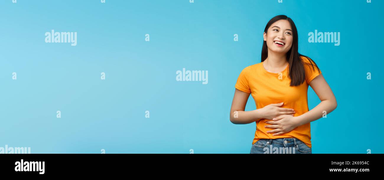 Happy staffed cute asian girl feelings satisfaction after eating ...