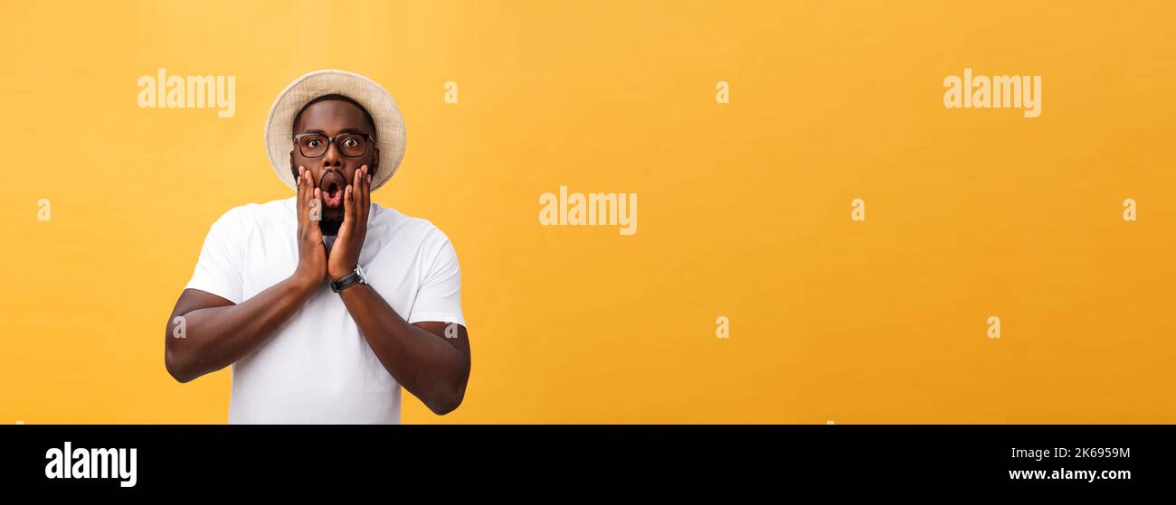 Headshot of goofy surprised bug-eyed young dark-skinned man student ...